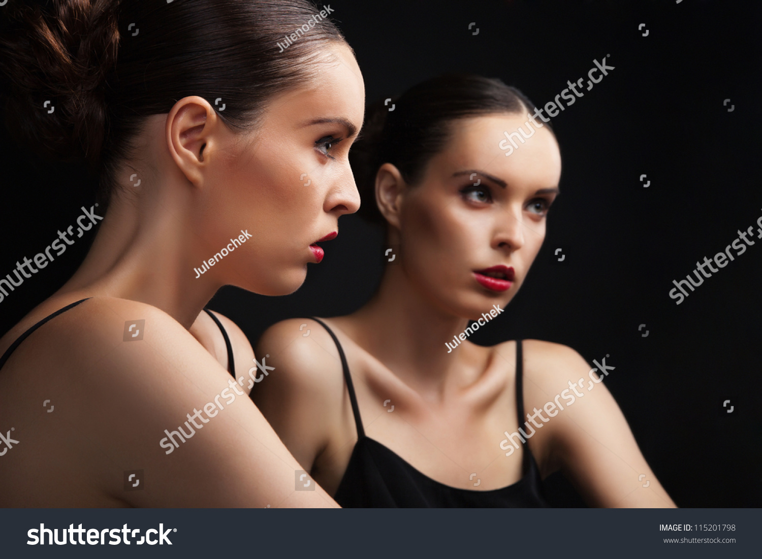Beautiful Sexy Young Woman Near A Mirror Over Black Background Stock