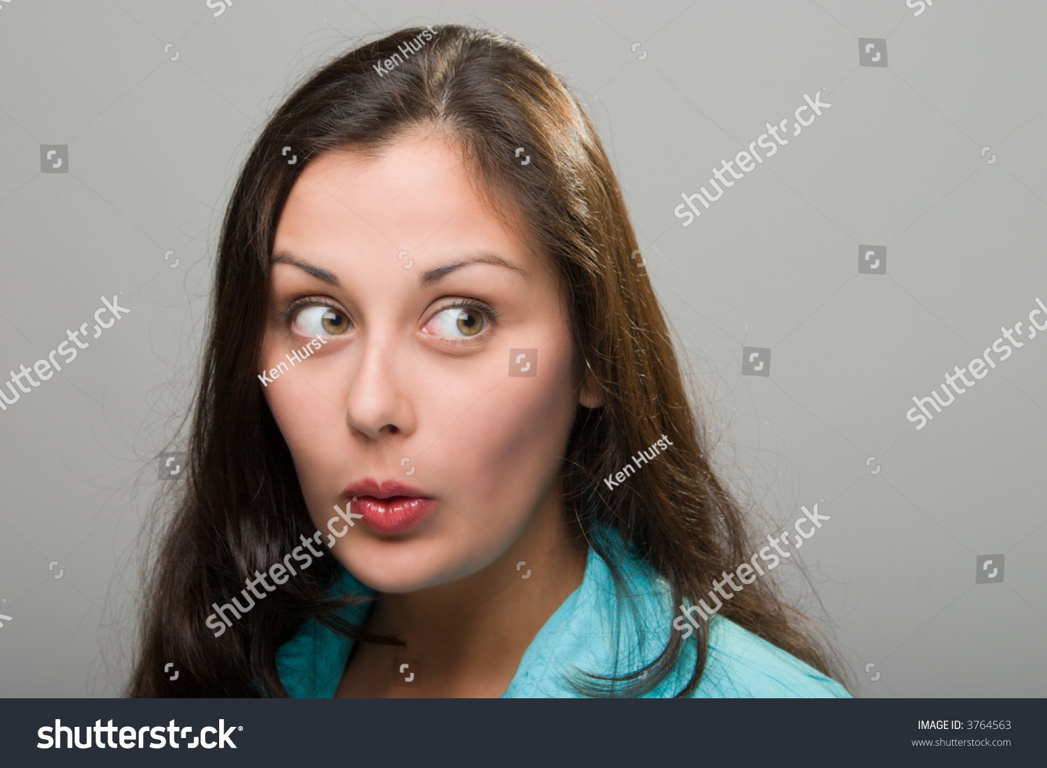 Beautiful Young Brunette Woman With Facial Expression Of Surprise