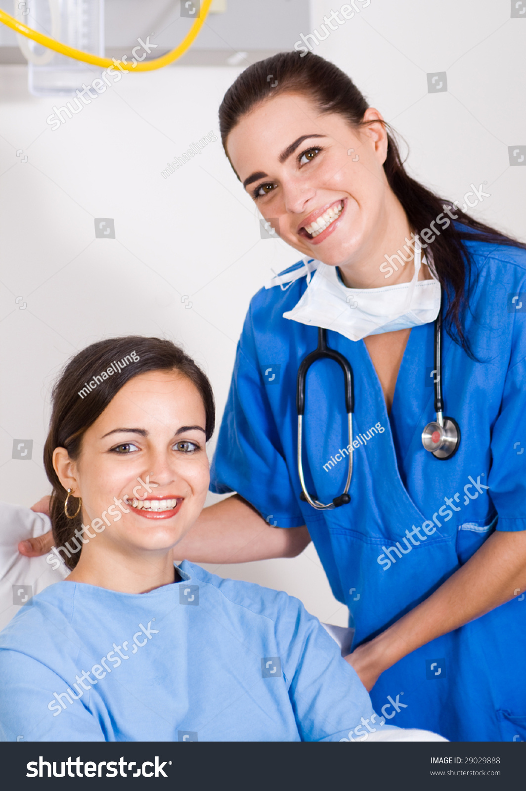 Friendly Nurse Helping Female Patient In Hospital Ward Stock Photo ... Friendly Nurse Helping Female Patient In Hospital Ward Stock Photo ...