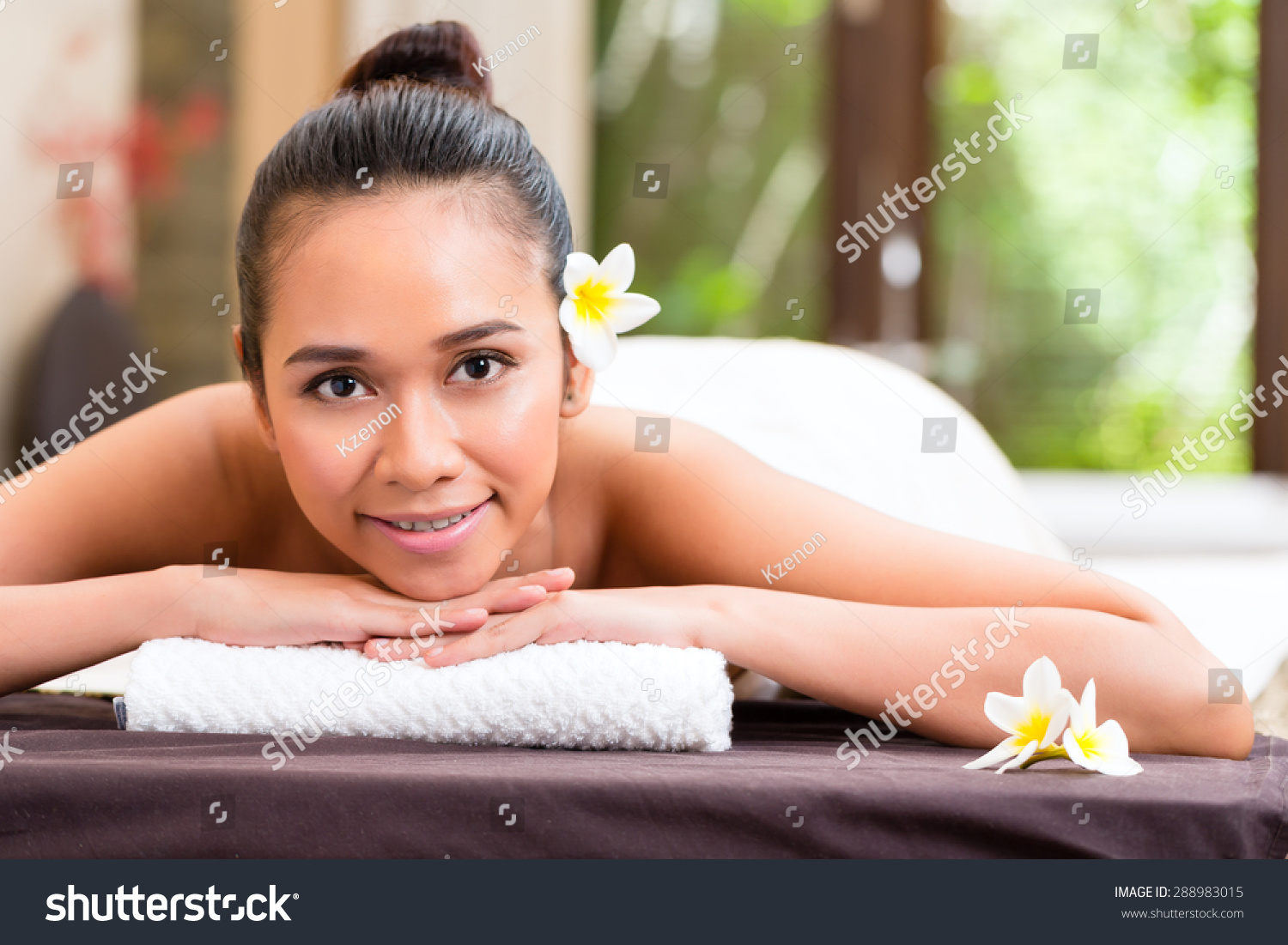 Indonesian Asian Woman In Wellness Beauty Day Spa Having Aroma Therapy Massage With Essential