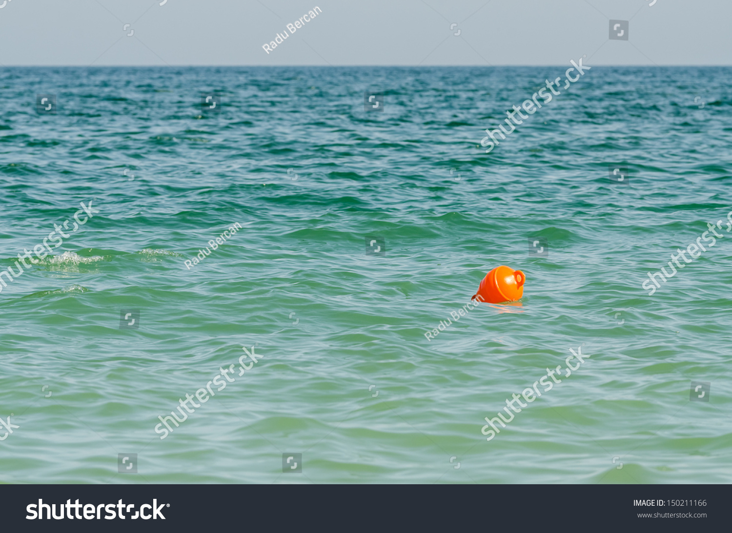 Orange Buoy Floating In Ocean Stock Photo 150211166 : Shutterstock Orange Buoy Floating In Ocean Stock Photo 150211166 : Shutterstock