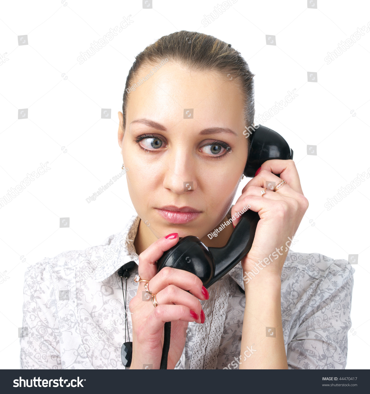 Portrait Of Attractive Woman Talking Old Fashioned Phone Over White
