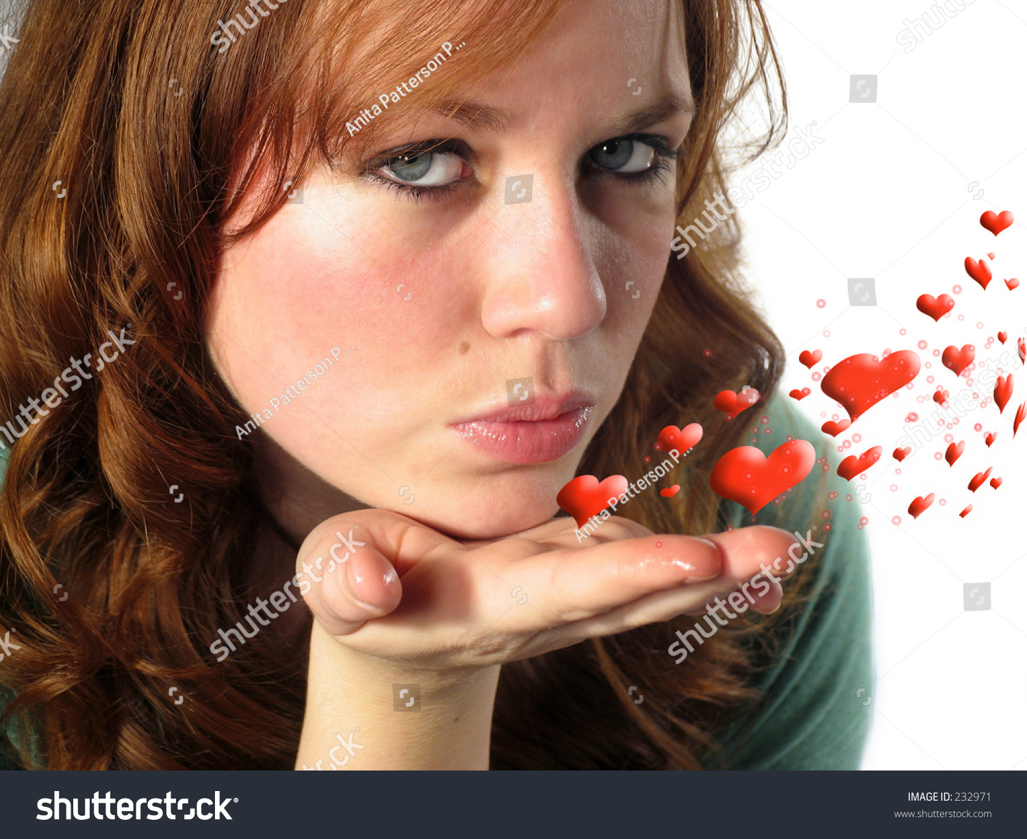 Pretty Young Woman Blowing A Kiss With A Swirl Of Hearts On White