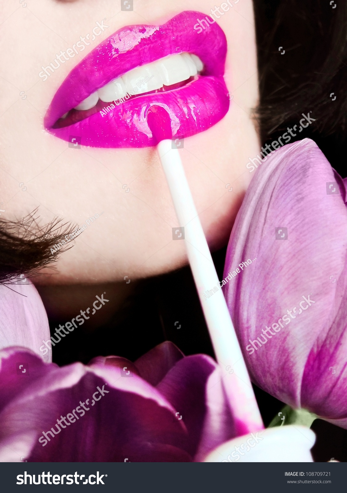 Sexy Pretty Young Woman Applying Pink Lip Gloss Lipstick On Her Lips