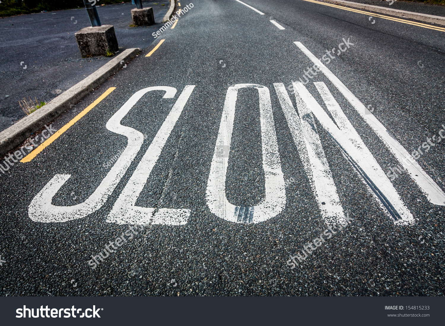 Worded Marking Slow Painted On The Road To Warn Drivers To Slow Down ... Worded Marking Slow Painted On The Road To Warn Drivers To Slow Down ...