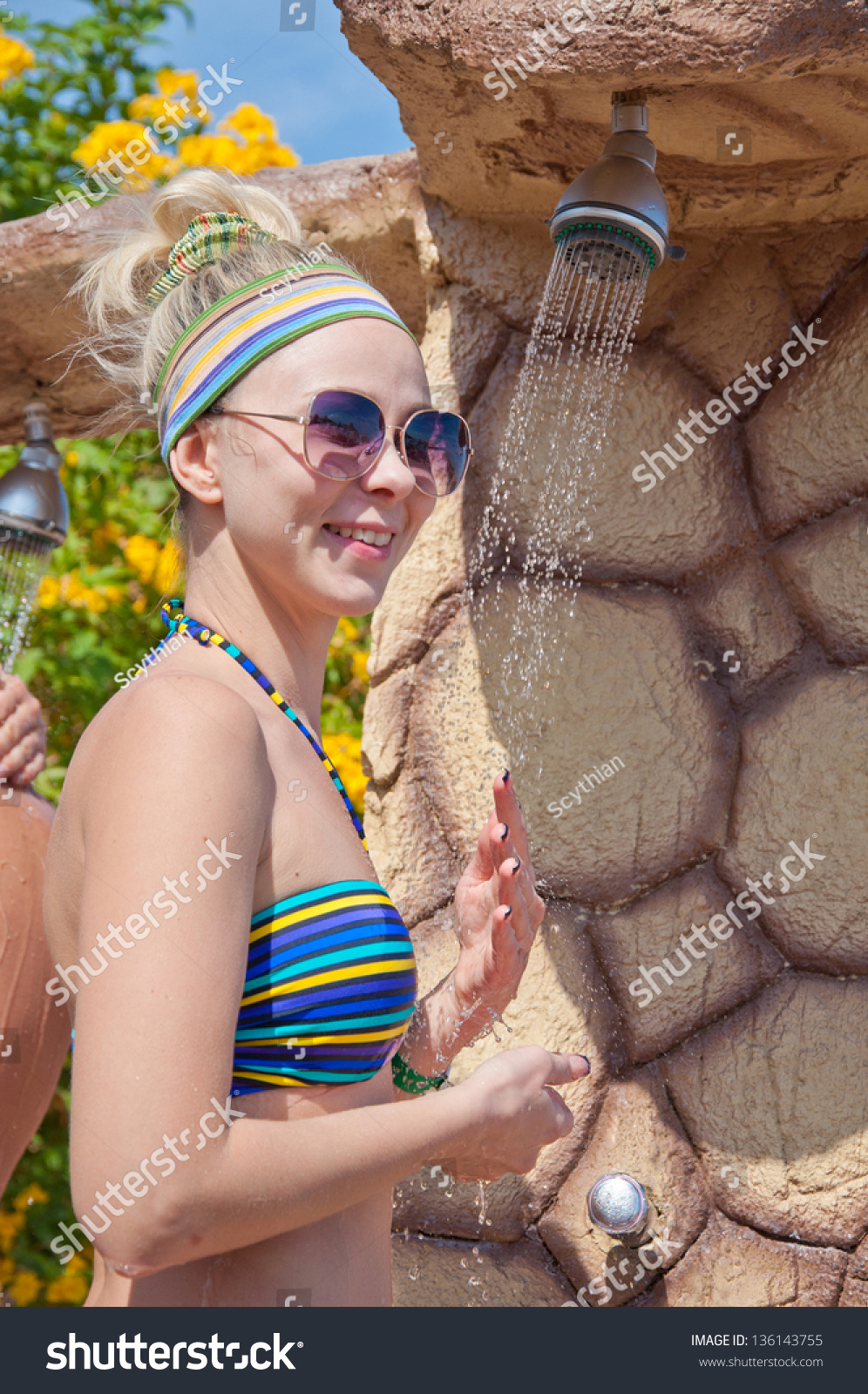 Young Beautiful Smiling Tanned Blond Woman In Bikini At Shower On A Sea