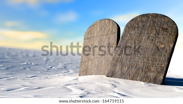 Two stone tablets representing the ten commandments standing in brown ...
