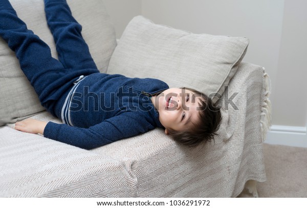 Active Kid Laying Upside Down On Stock Photo (Edit Now) 1036291972