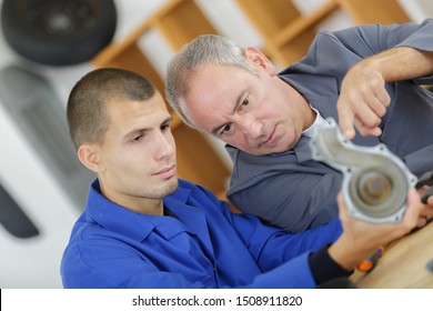 Apprentice Mechanic Mentor Analyzing Broken Part Stock Photo 1508911820 ...