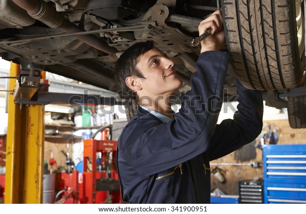 Apprentice Mechanic Working Under Car 스톡 사진 341900951 | Shutterstock