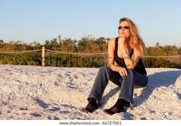 Стоковая фотография 66727861 Attractive Sexy Middle Aged Woman Posing