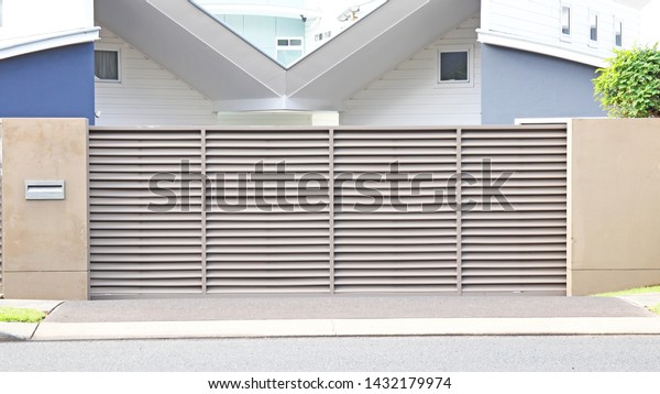 Automatic Sliding Front Gate Horizontal Slats Stock Photo (Edit Now ...