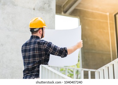 Back Engineer Holding Blueprint Building Background Stock Photo ...
