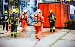 Group of firemen fighting with fire, a Person Photo by art PVP - market