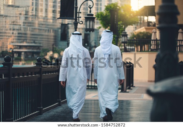 Back Two Arabic Men Walking Dubai Stock Photo (Edit Now) 1584752872