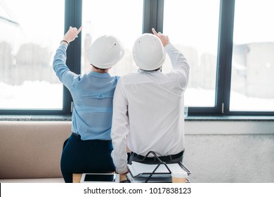 Back View Architects Pointing Through Window Stock Photo 1017838123 ...