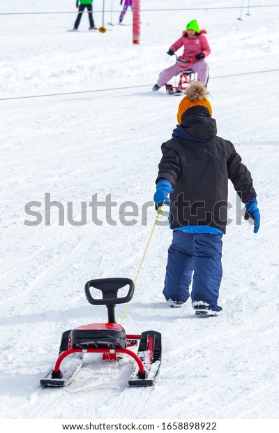 Back View Child Pulling Sledge Running Stock Photo 1658898922 ...