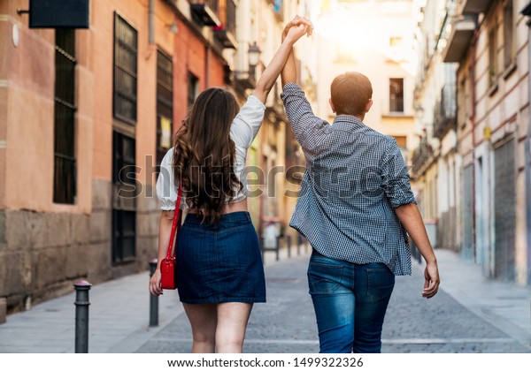 Back View Couple Holding Hands Raising Stock Photo 1499322326 ...