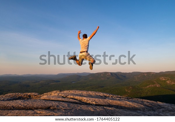 Back View Man Jumping Summit La Stock Photo 1764405122 | Shutterstock