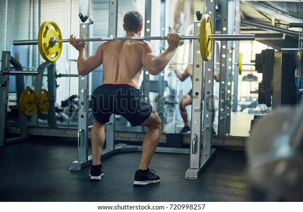 Back View Young Bodybuilder Flexing Muscles Stock Photo 720998257 ...