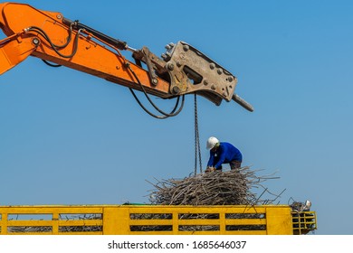 Backhoe Loading Rebar Scrap On Truck Stock Photo (Edit Now) 1685646037