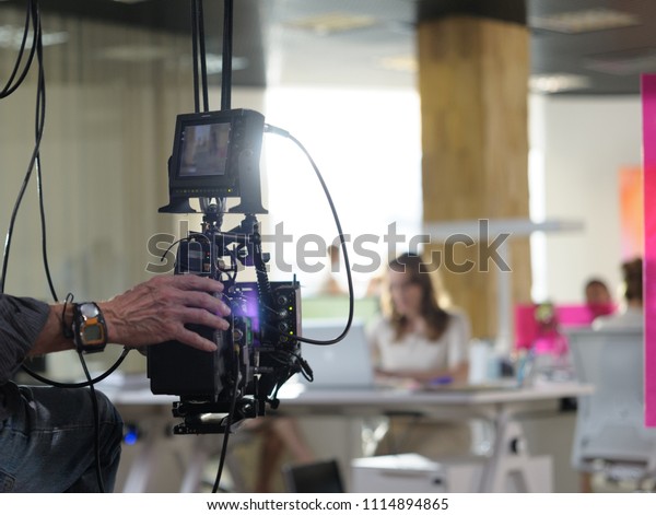 Behind the scenes of the camera when shooting a film, advertisement ...