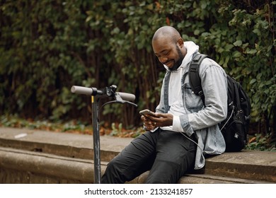 167 Man Using Phone While Riding Scooter Images, Stock Photos & Vectors ...
