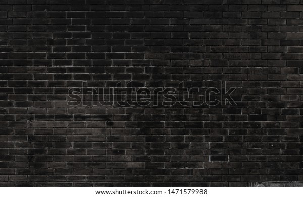 La superficie de la pared negra usa muchos ladrillos. O el viejo patrón ...