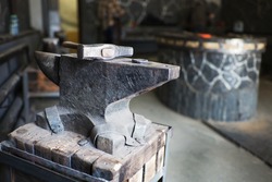 Muscular blacksmith in forge hammering steel products, a Photo by ...