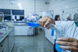 Pipette dropping green sample chemic featuring agriculture, analyzing ...