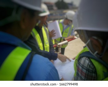 Blurred Engineering Group Explaining Construction Drawings Stock Photo ...