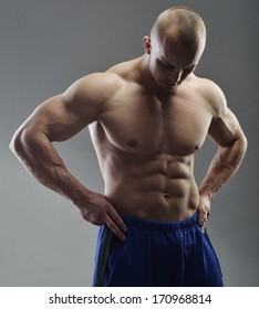 Attractive Muscular Body Builder Posing Colored Stock Photo (Edit Now ...