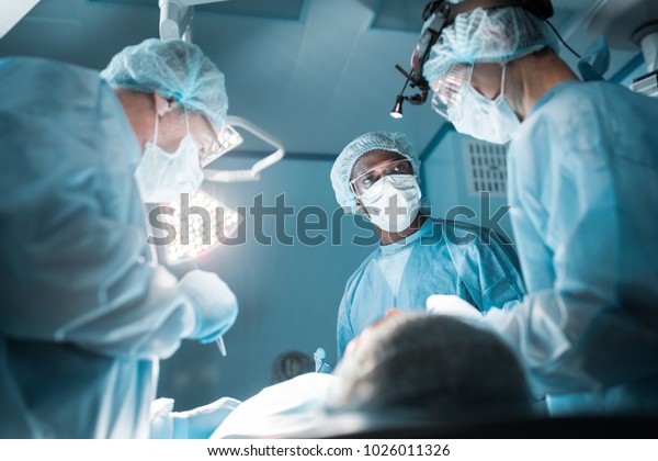 Bottom View Multicultural Surgeons Operating Patient Stock Photo ...