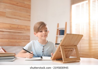 Boy Doing Homework Tablet Table Indoors Stock Photo 2195830945 ...