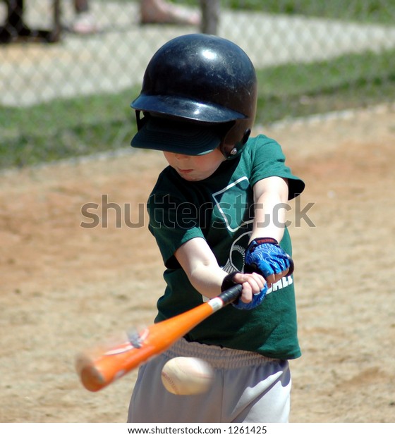 Boy Hitting Baseball Stock Photo 1261425 | Shutterstock
