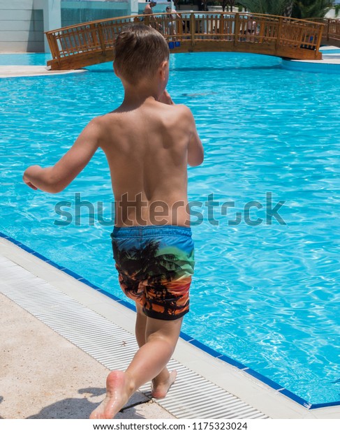 Boy Jumping Into Pool Stock Photo 1175323024 | Shutterstock