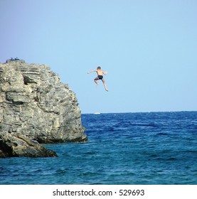 Boy Jumping Off Cliff Stock Photo 529693 | Shutterstock