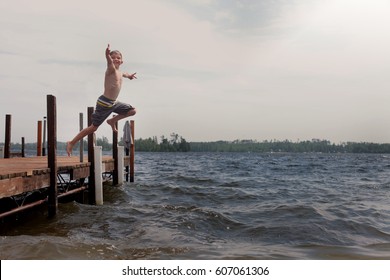 545 Jumping off dock Images, Stock Photos & Vectors | Shutterstock
