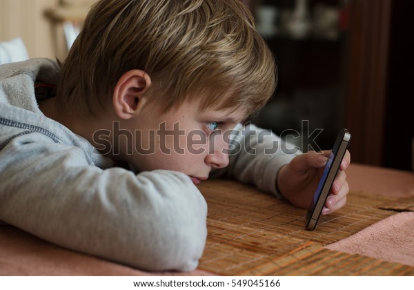 Boy Looking Smartphone Stock Photo (Edit Now) 549045166