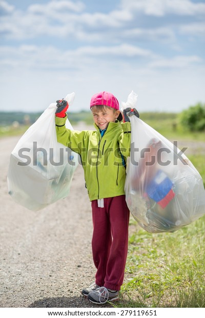 Boy Picking Trash Stock Photo (Edit Now) 279119651