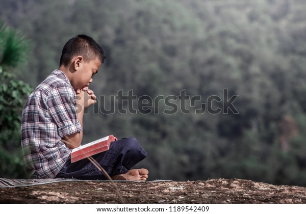 Boy Praying On Scriptures Bible 스톡 사진(지금 편집) 1189542409