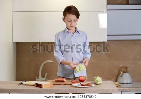 Boy Stands Kitchen Front Table Prepares Stock Photo 1755378542 ...