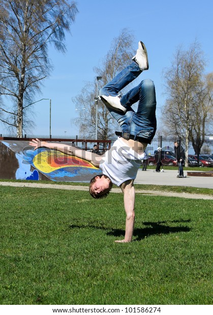 Breakdancer Doing Flip On Grass Stock Photo (Edit Now) 101586274