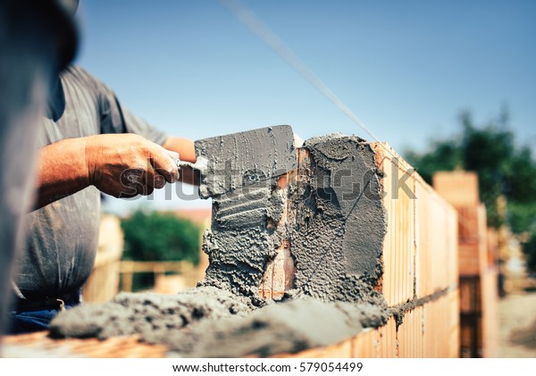 Bricklayer Construction Worker Installing Brick Masonry Stock Photo ...
