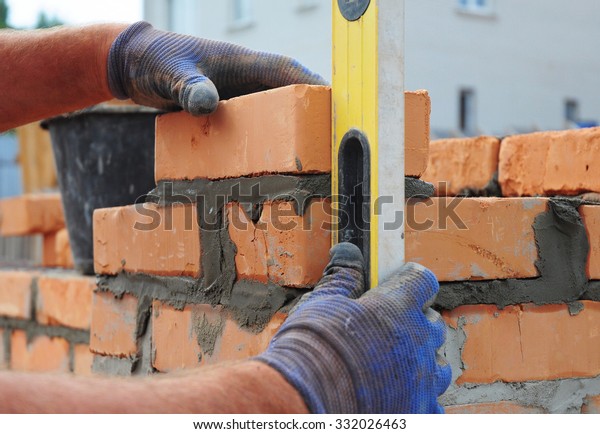 Bricklayer Using Spirit Level Check New Stock Photo (Edit Now) 332026463