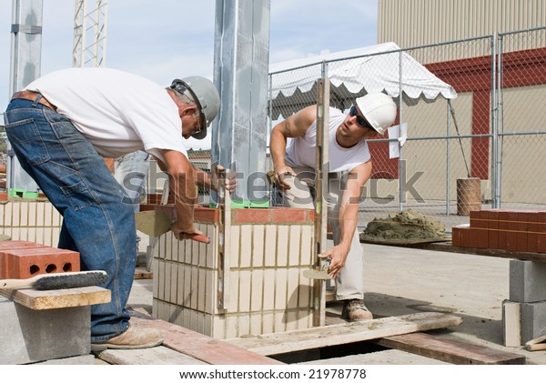 Bricklayers Using Levels Stock Photo 21978778 | Shutterstock
