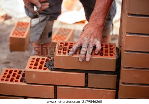 Builder Laying Bricks On Construction Site Stock Photo 2179846265 ...