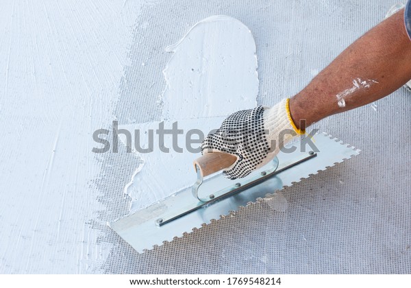 Builder Using Plastering Tool Finishing Wall Stock Photo 1769548214 ...