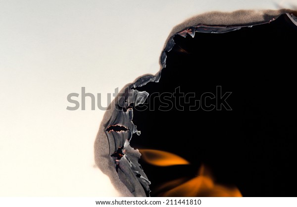 Стоковая фотография 211441810: Burning Hole Forms On Side White ...