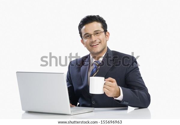 Businessman Drinking Coffee While Working On Stock Photo (Edit Now ...